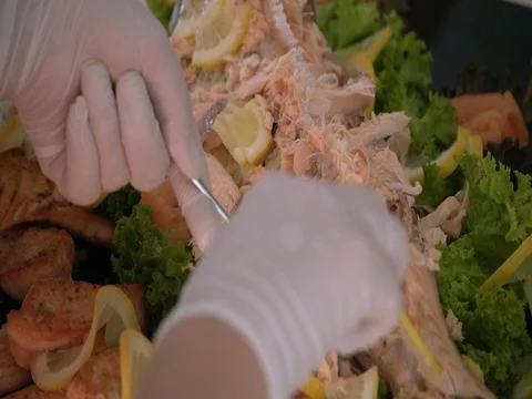 buffet guests put food in the dish | Stock Video | Pond5