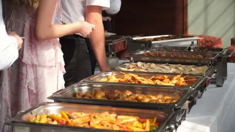buffet, guests put food on their plates | Stock Video | Pond5