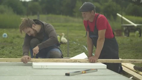 Builders making foundation for new hen h... | Stock Video | Pond5