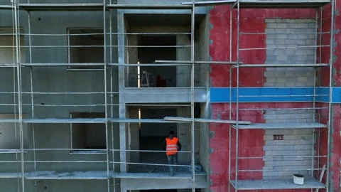 Builders work facing the building stand ... | Stock Video | Pond5