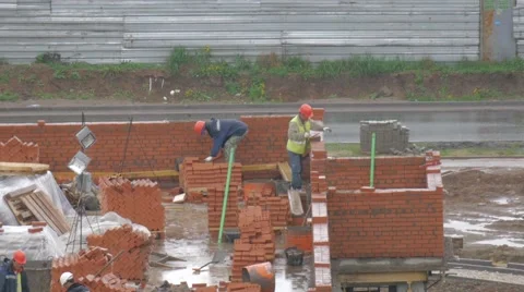 Building brick block wall on constructio... | Stock Video | Pond5