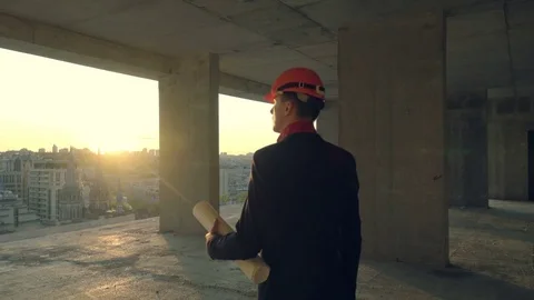 Building Engineer with a building plan o... | Stock Video | Pond5