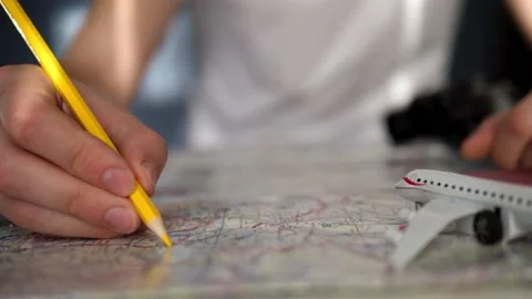 Building a route for travel on a paper m... | Stock Video | Pond5