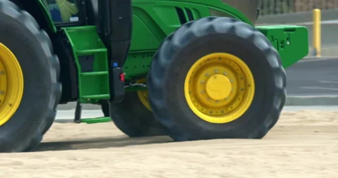 Bulldozer with large tires moving fast o... | Stock Video | Pond5