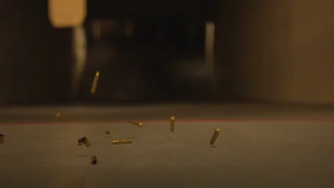 Bullet Casings Falling on a Shooting Ran... | Stock Video | Pond5