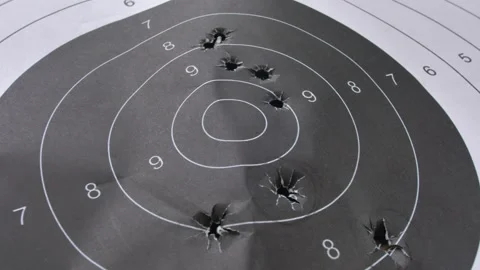 Bullet-Riddled Paper Shooting Target Clo... | Stock Video | Pond5