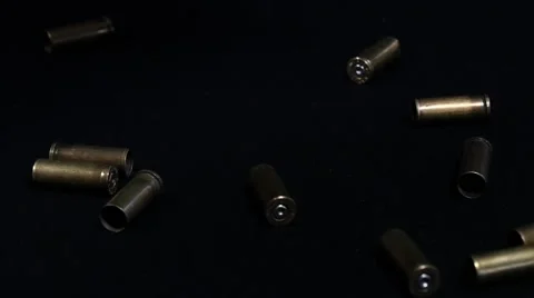 Bullet Shells Falling Stock Footage ~ Royalty Free Stock Videos | Pond5