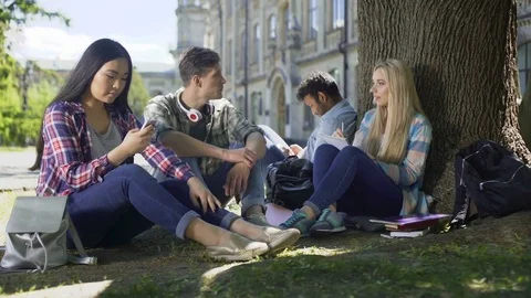 Bunch of friends interacting between eac... | Stock Video | Pond5