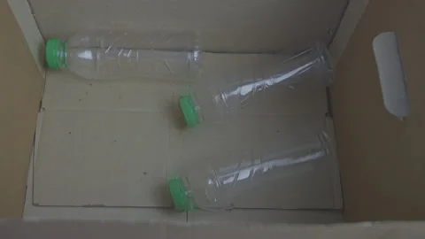 Bunch of plastic bottles falling into ca... | Stock Video | Pond5