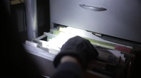 Burglar going through Filing Cabinet | Stock Video | Pond5