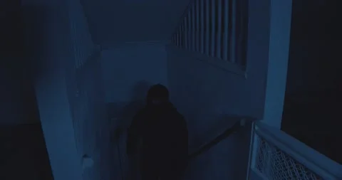 Burglar wearing a ski mask in a house | Stock Video | Pond5