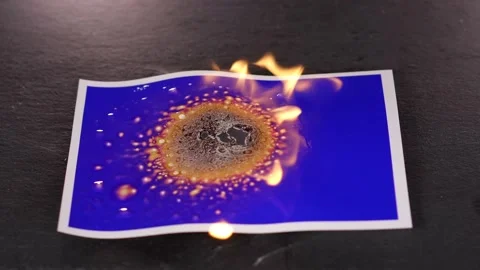 Burn blue photograph in fire on a black ... | Stock Video | Pond5