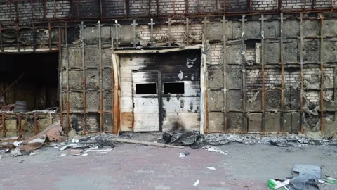 Burned building. Ruins of a garage. Apoc... | Stock Video | Pond5