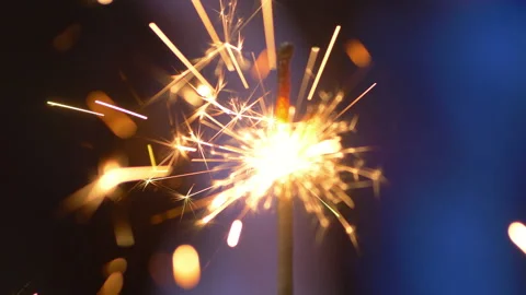 Burning bengal fire and sparks on defocu... | Stock Video | Pond5