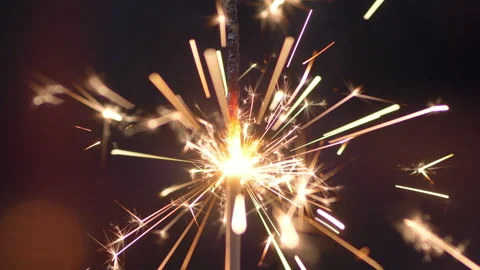 Burning bengal fire and sparks on defocu... | Stock Video | Pond5