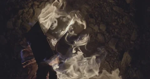 Burning camping bone fire from above in ... | Stock Video | Pond5