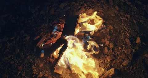 Burning camping bone fire from above in ... | Stock Video | Pond5