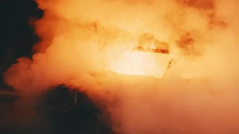 Burning car in thick smoke. Crime scene.... | Stock Video | Pond5