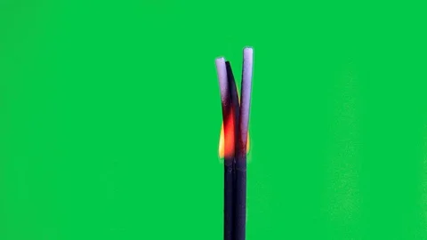 A burning incense stick on green screen ... | Stock Video | Pond5