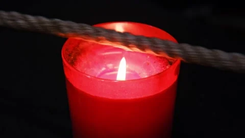 Burning a jute rope on the fire of a can... | Stock Video | Pond5