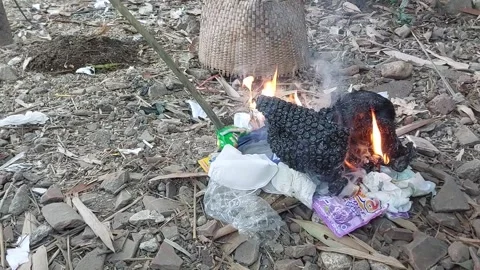 burning plastic waste in the yard in the... | Stock Video | Pond5