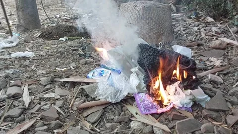 burning plastic waste in the yard in the... | Stock Video | Pond5