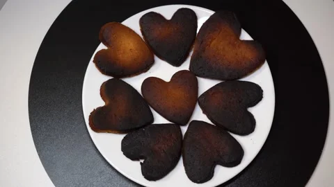 Burnt pastries, heart shaped shortbread ... | Stock Video | Pond5