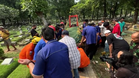 Burrial of 300 KG Man in Jakarta, Indone... | Stock Video | Pond5