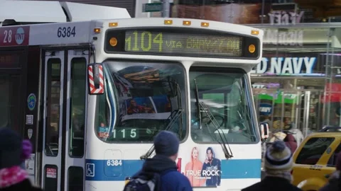 Bus driving past crowds on busy street i... | Stock Video | Pond5