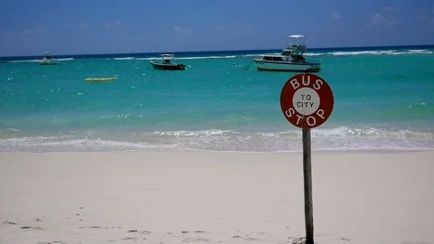Bus Stop on a Beach with Boats in Backgr... | Stock Video | Pond5