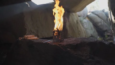 Bushcraft hobo stove fire in nature cave... | Stock Video | Pond5