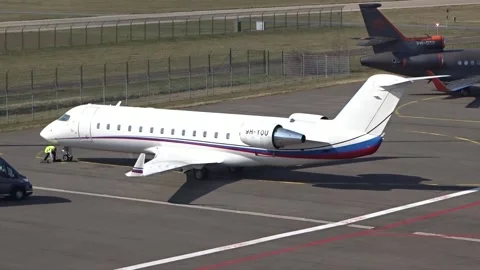 Business Jet being secured at Airport wi... | Stock Video | Pond5