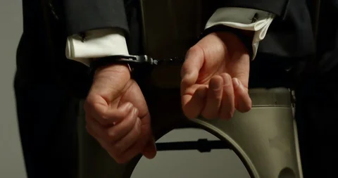Business man handcuffed to chair - from ... | Stock Video | Pond5