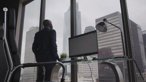 Business Man Peering Out Office Window | Stock Video | Pond5