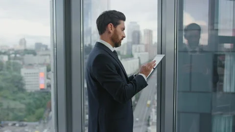Business man scrolling tablet at office ... | Stock Video | Pond5