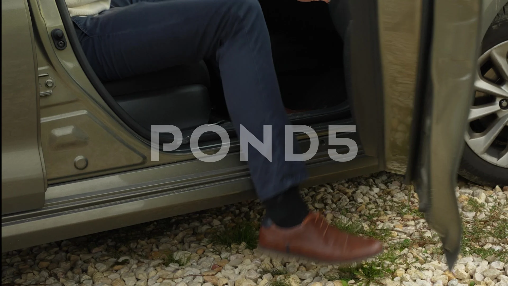 Guy Stepping Out Of Car