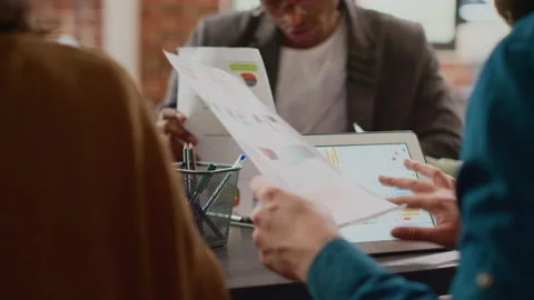 Business people looking at corporate inf... | Stock Video | Pond5