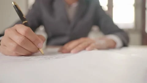 Business people review and sign document... | Stock Video | Pond5