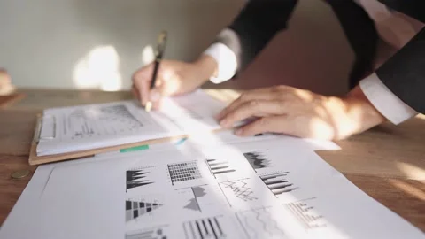 Business people review and sign document... | Stock Video | Pond5