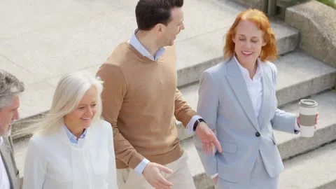 Business people talking while walking do... | Stock Video | Pond5