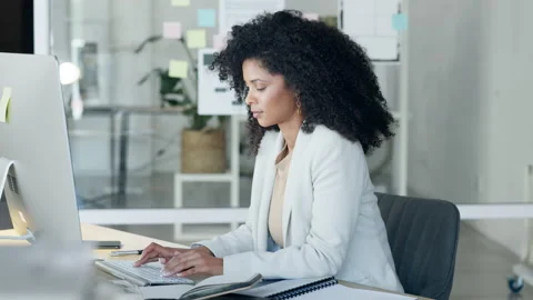 Business woman typing an email, looking ... | Stock Video | Pond5