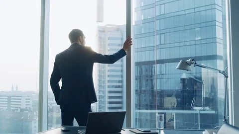 Businessman Looking out of Office Window... | Stock Video | Pond5