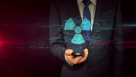 Businessman with smartphone and nuclear ... | Stock Video | Pond5