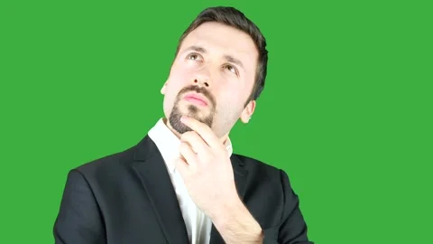 Businessman is thinking, green screen | Stock Video | Pond5