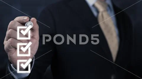 Businessman use pen to tick correct sign mark in checkbox for quality ...