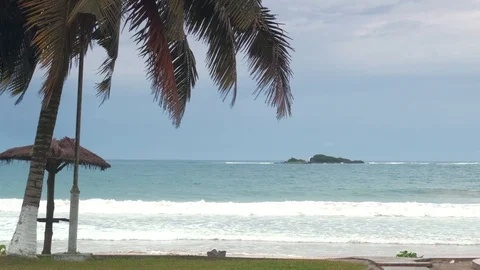 busua beach zoom in shot with abokwa isl... | Stock Video | Pond5