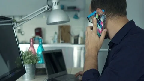 Busy, multitasking man working at home s... | Stock Video | Pond5