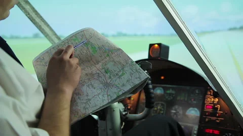 Busy pilot examining flight route map, c... | Stock Video | Pond5