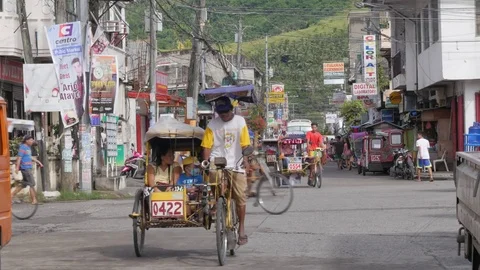 Busy street traffic with tricycles,Catba... | Stock Video | Pond5