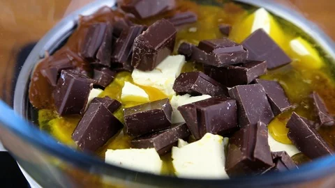 Butter and chocolate melting together sl... | Stock Video | Pond5